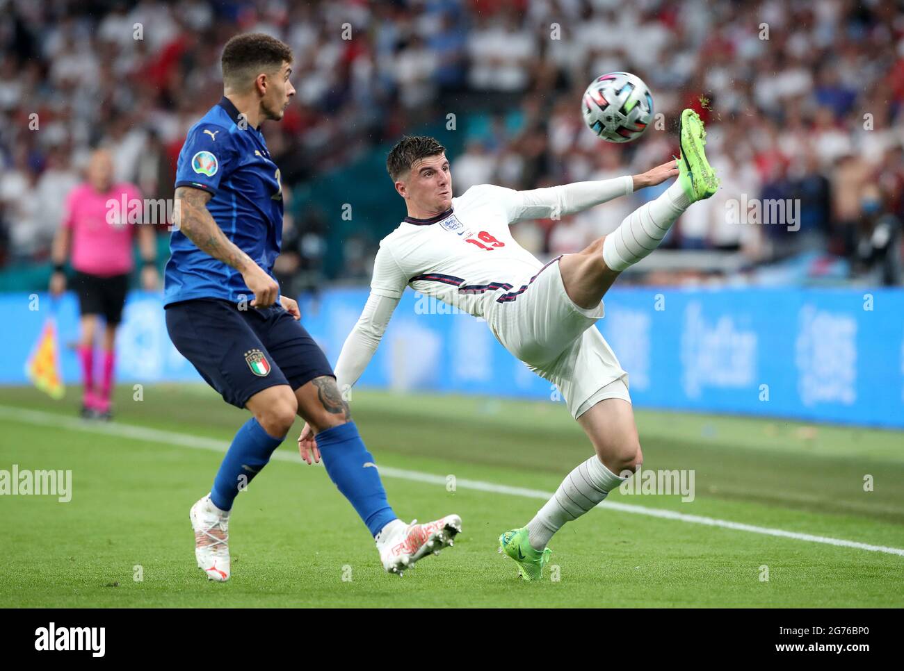 Italy's Giovanni Di Lorenzo (left) and England's Mason Mount in action ...