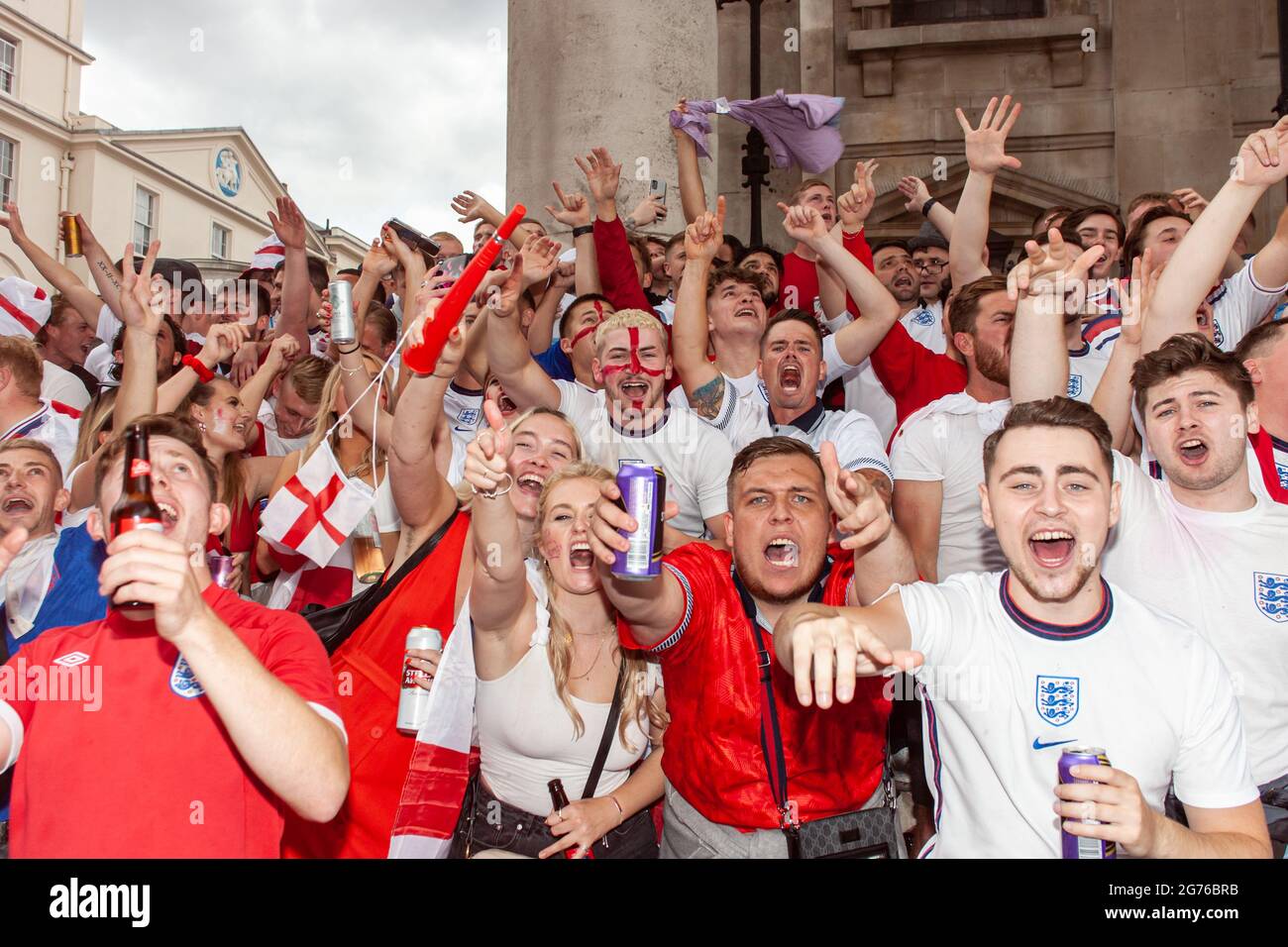 London, England. 11 Jul 2021. Wall of drunk fans celebrate outside ...