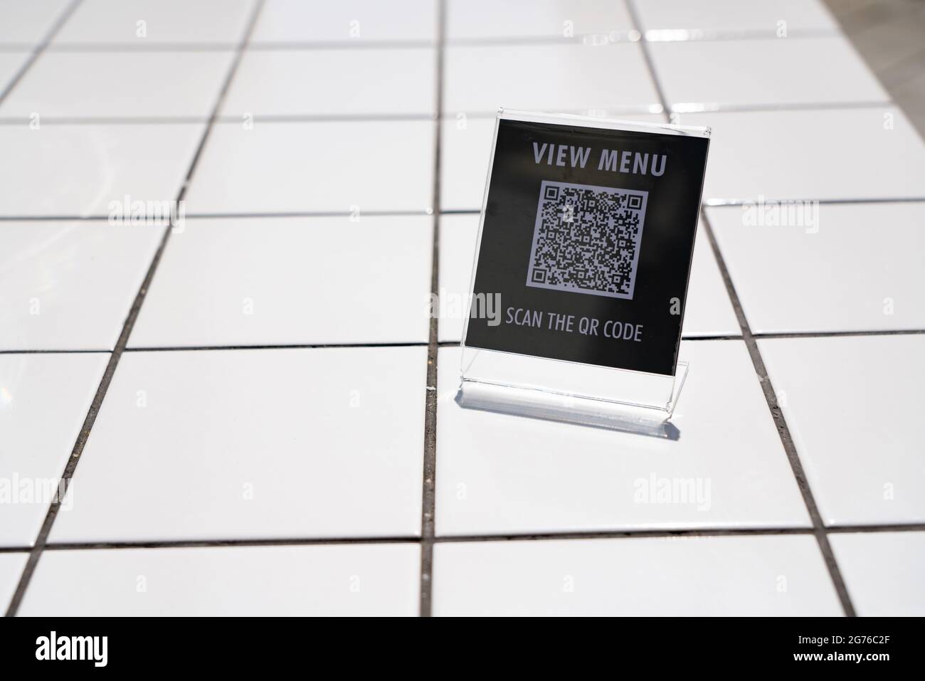 View menu and Scan the QR code sign on the table in the cafe Stock ...