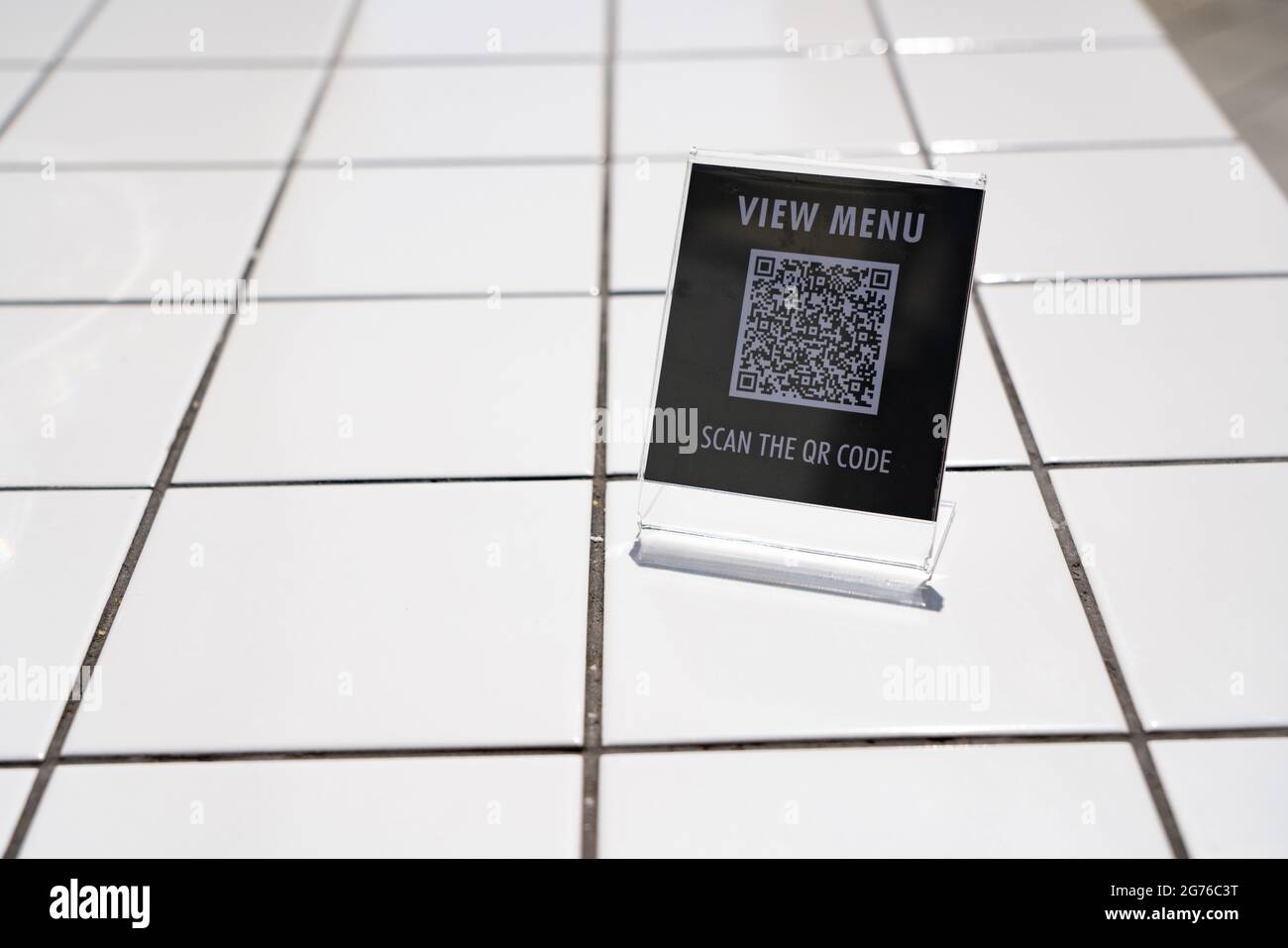 View menu and Scan the QR code sign on the table in the cafe Stock ...