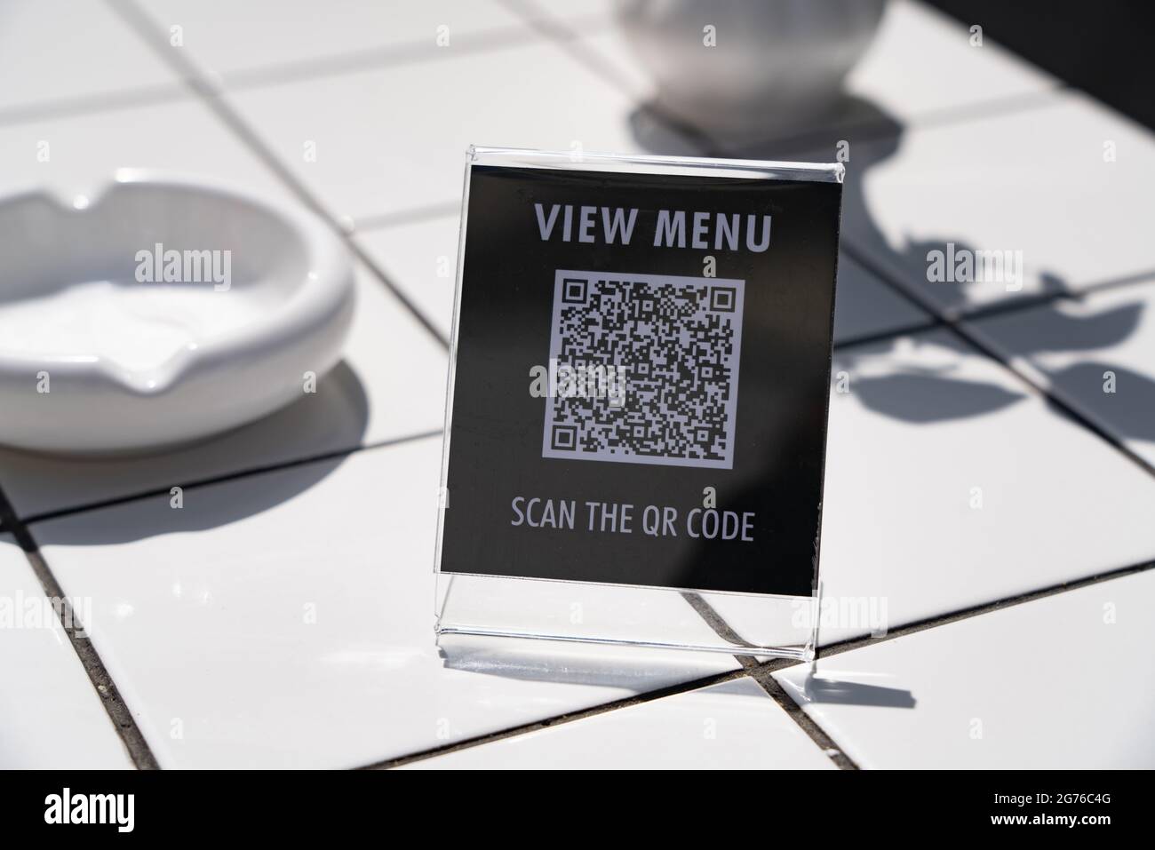 View menu and Scan the QR code sign on the table in the cafe Stock ...