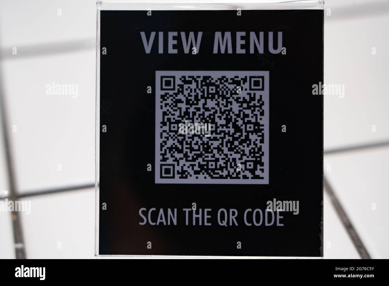 View menu and Scan the QR code sign on the table in the cafe Stock ...