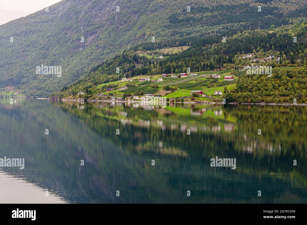 Reflection in Norway fjord at fall time Stock Photo - Alamy