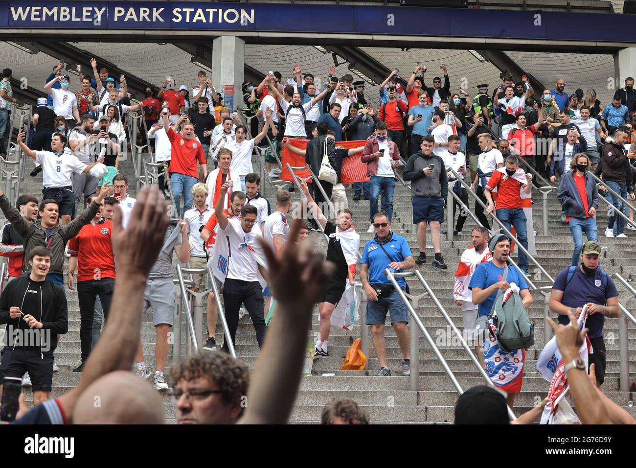 London, UK. 11th July, 2021. Football fans head to the Wembley Stadium ...