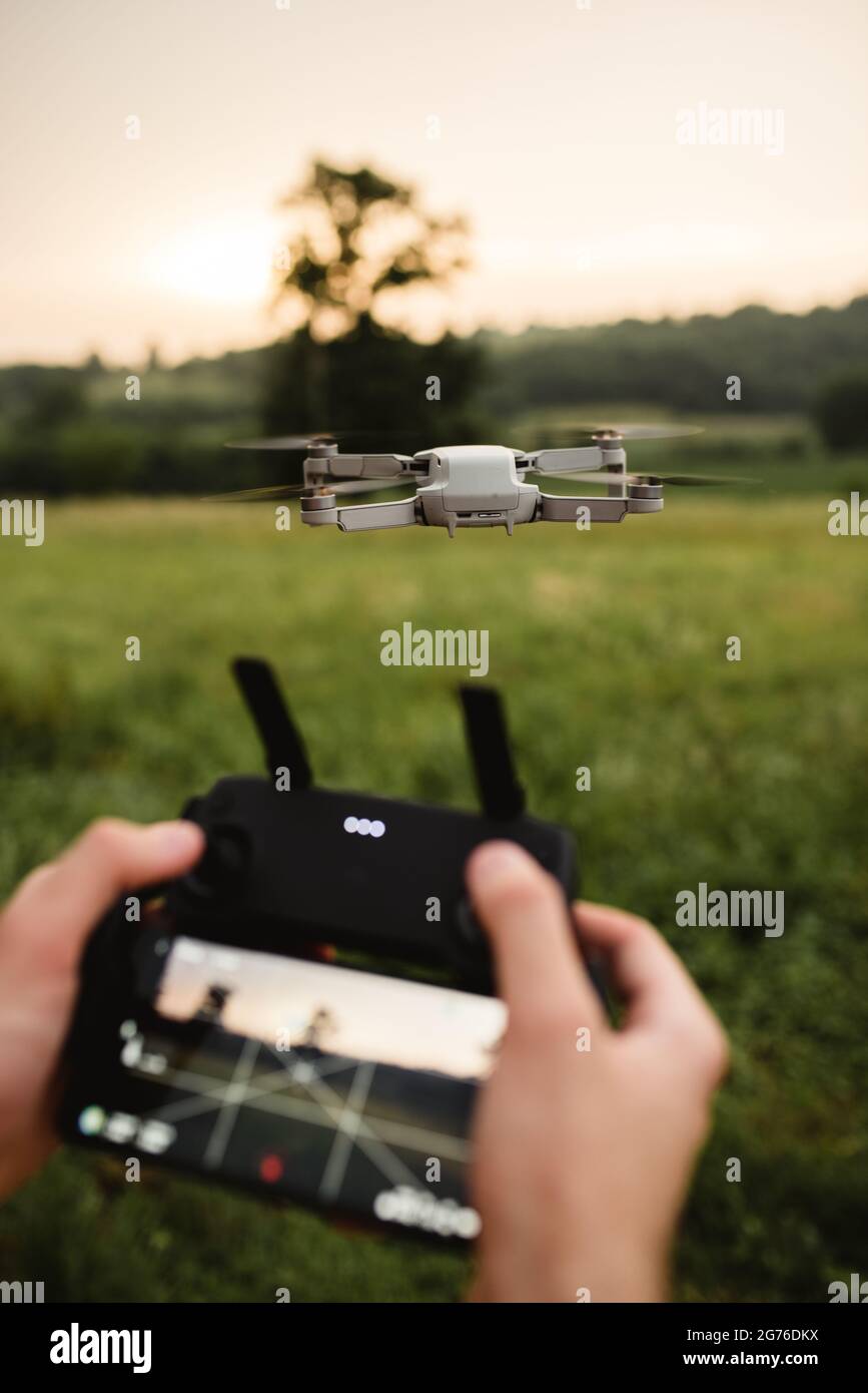 a photograph of the pilot operating a drone Stock Photo - Alamy