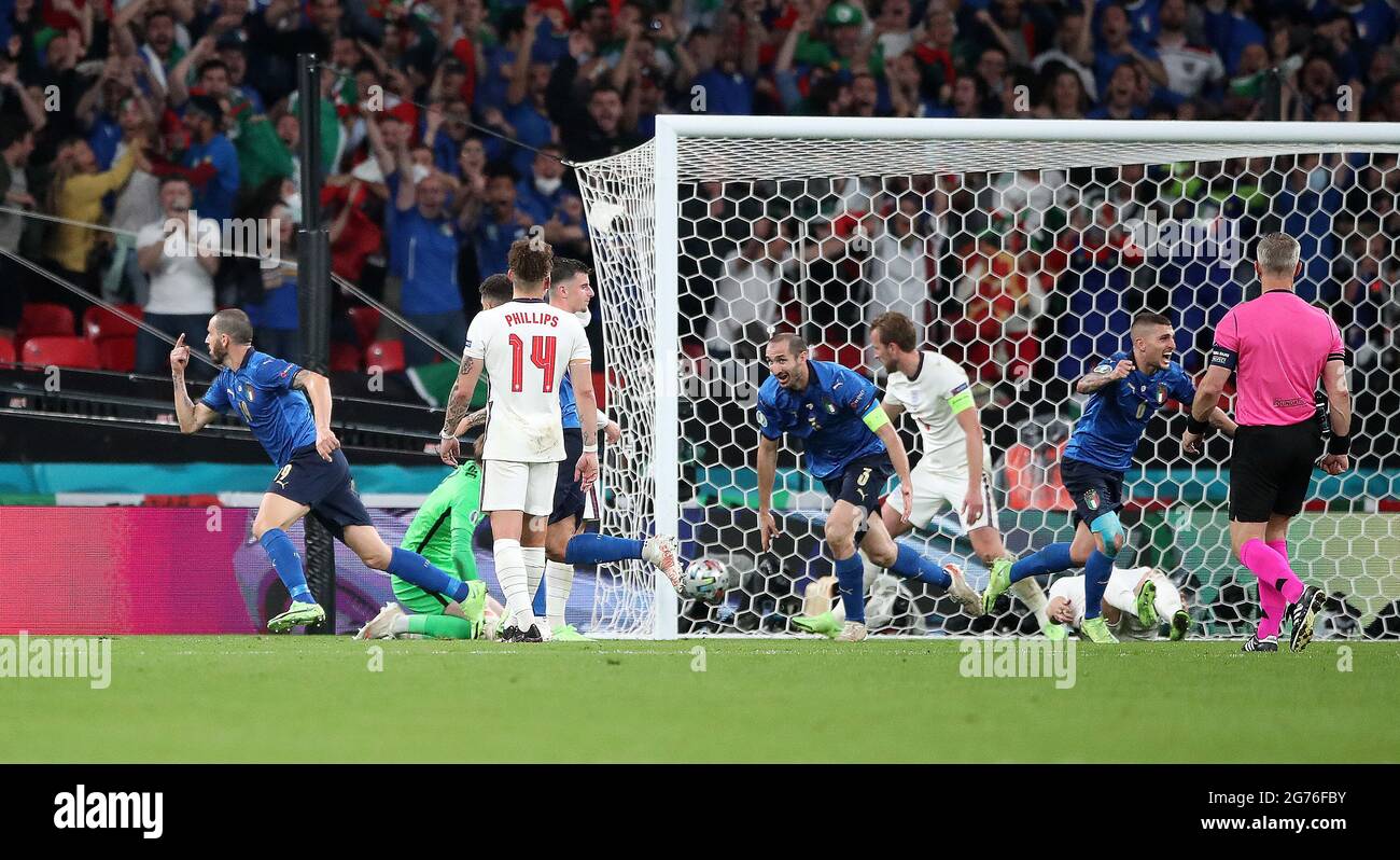 Italy's Leonardo Bonucci (left) celebrates scoring their side's first ...