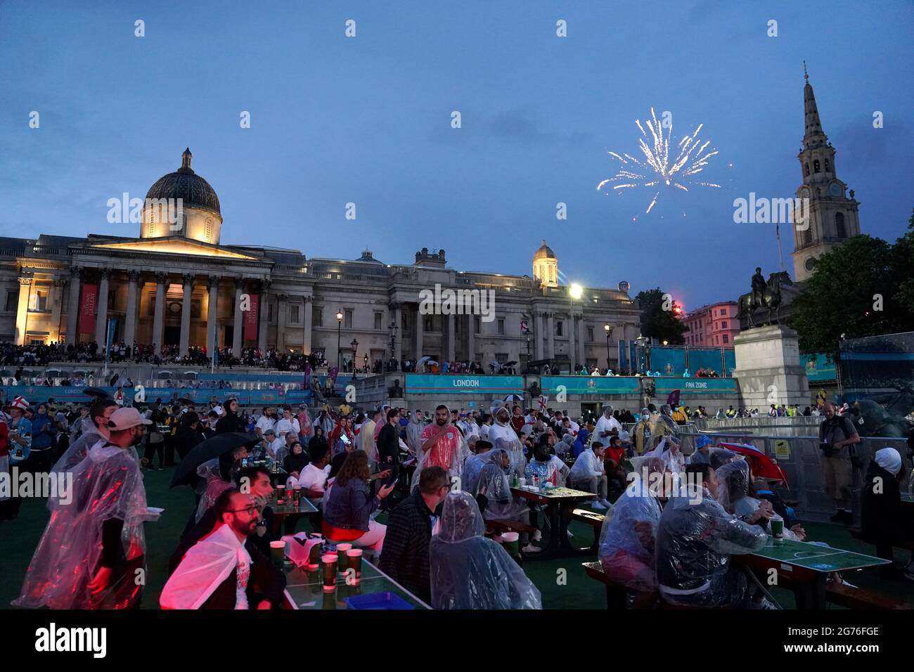 Fireworks are set off as at the Trafalgar Square Fan Zone in London as ...