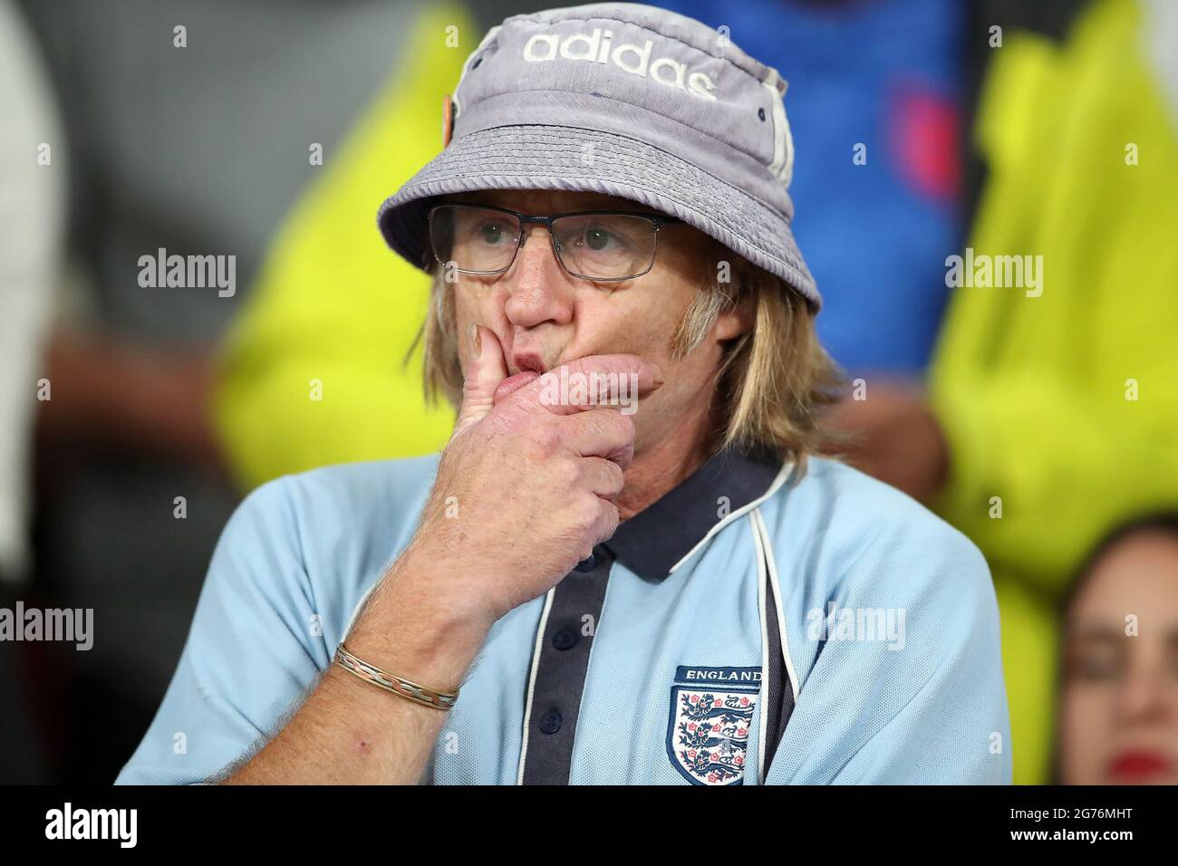 An England fan looks nervous ahead of the penalty shoot-out during the ...