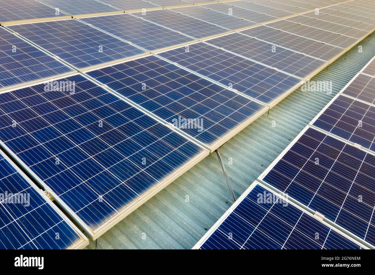 Aerial view of surface of blue photovoltaic solar panels mounted on ...