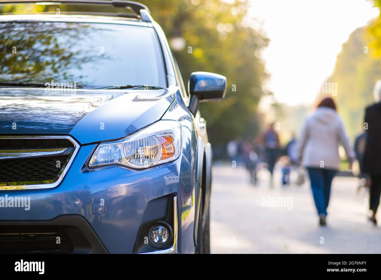 New clean car parked on a city street side Stock Photo - Alamy