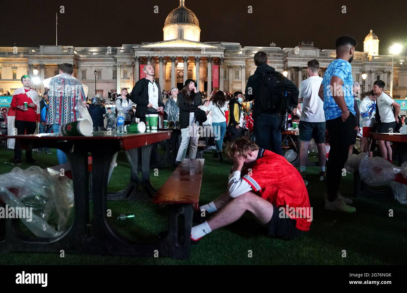 England fans are dejected after England lose the game on penalties at ...