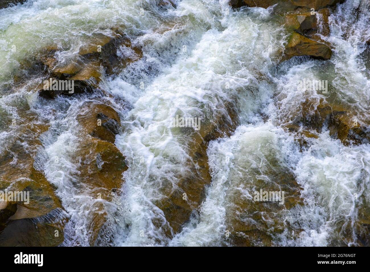 Aerial view of river waterfall with clear turquoise water falling down ...