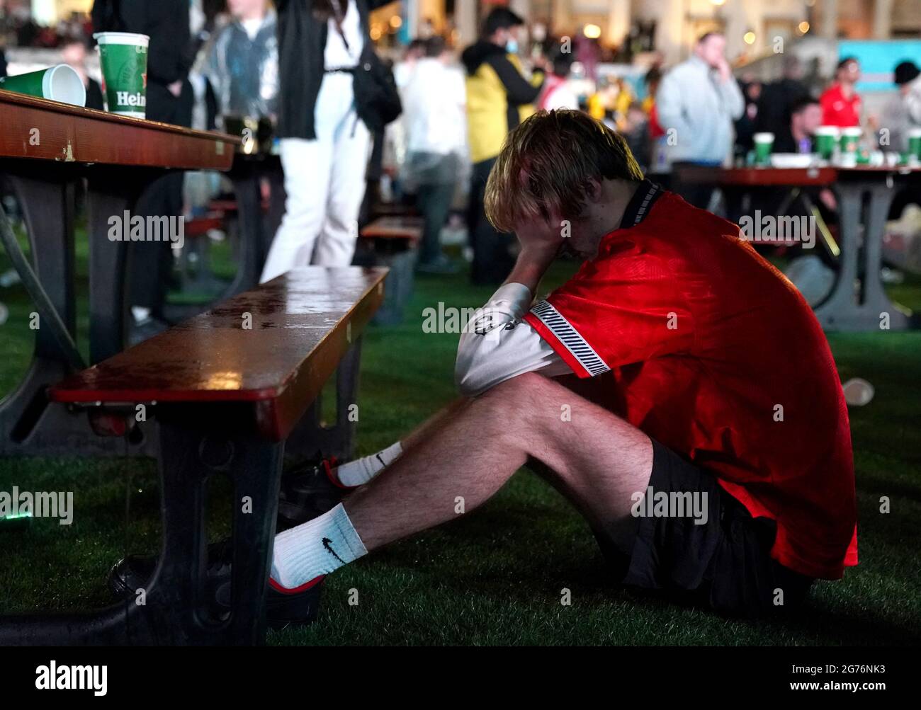 England fans are dejected after England lose the game on penalties at ...