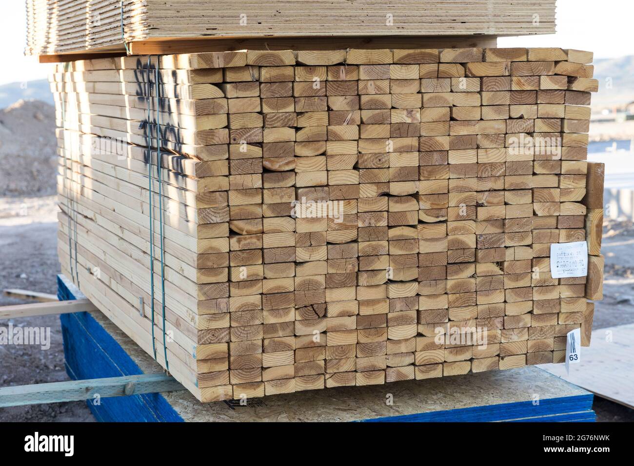 Stack of lumber pieces strapped together on a construction site Stock ...