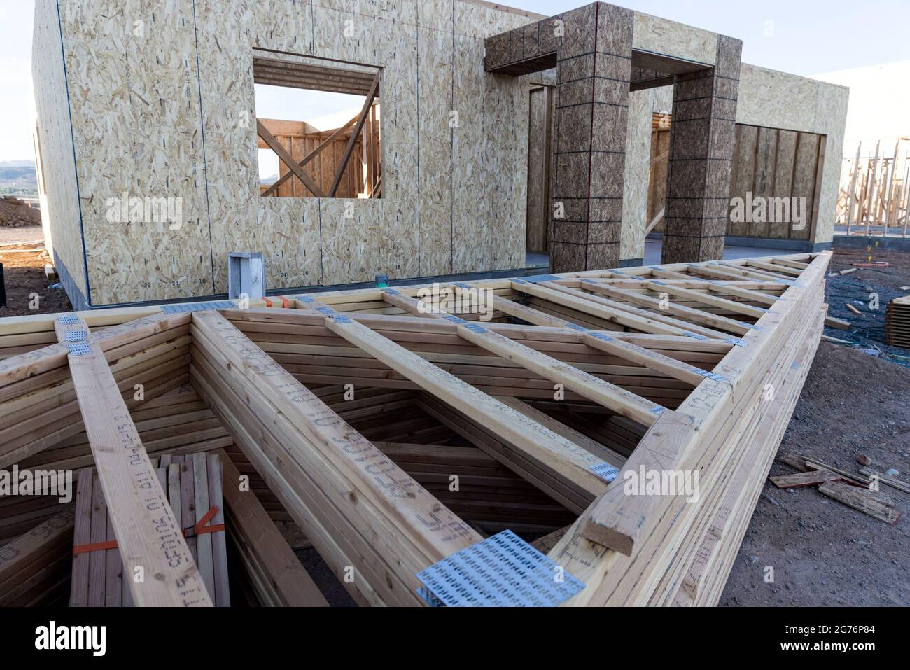 Roofing joists sit in stacks ready to be added to constuction project ...