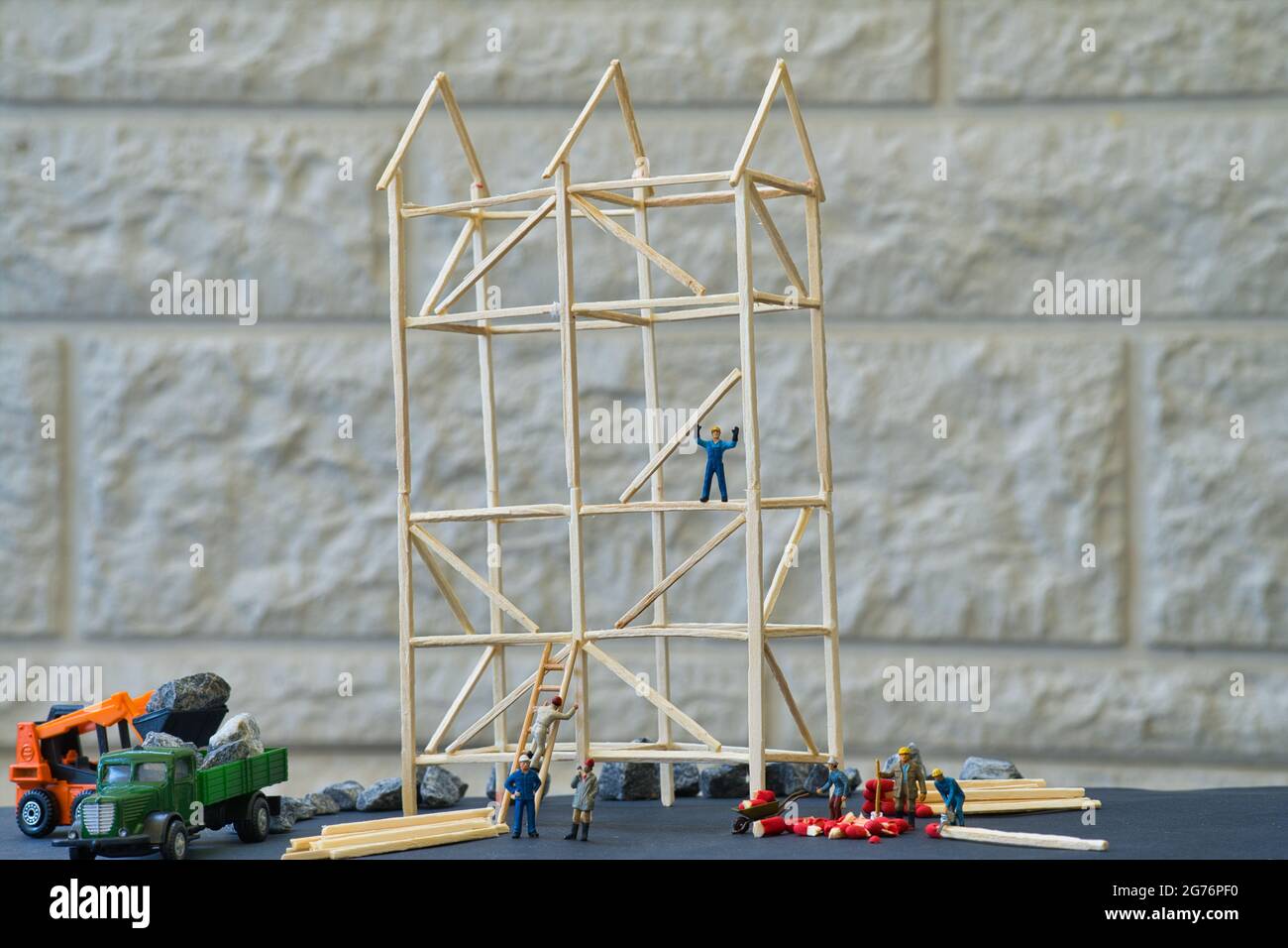 Team building miniature construction workers hi-res stock photography ...