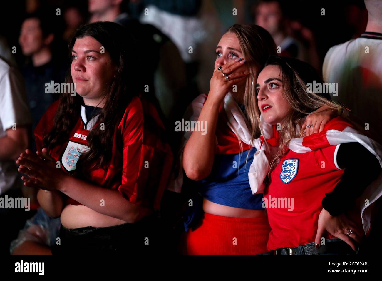 England fans are dejected after England lose the game on penalties at ...