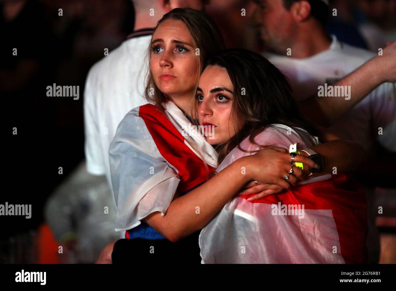 England fans are dejected after England lose the game on penalties at ...