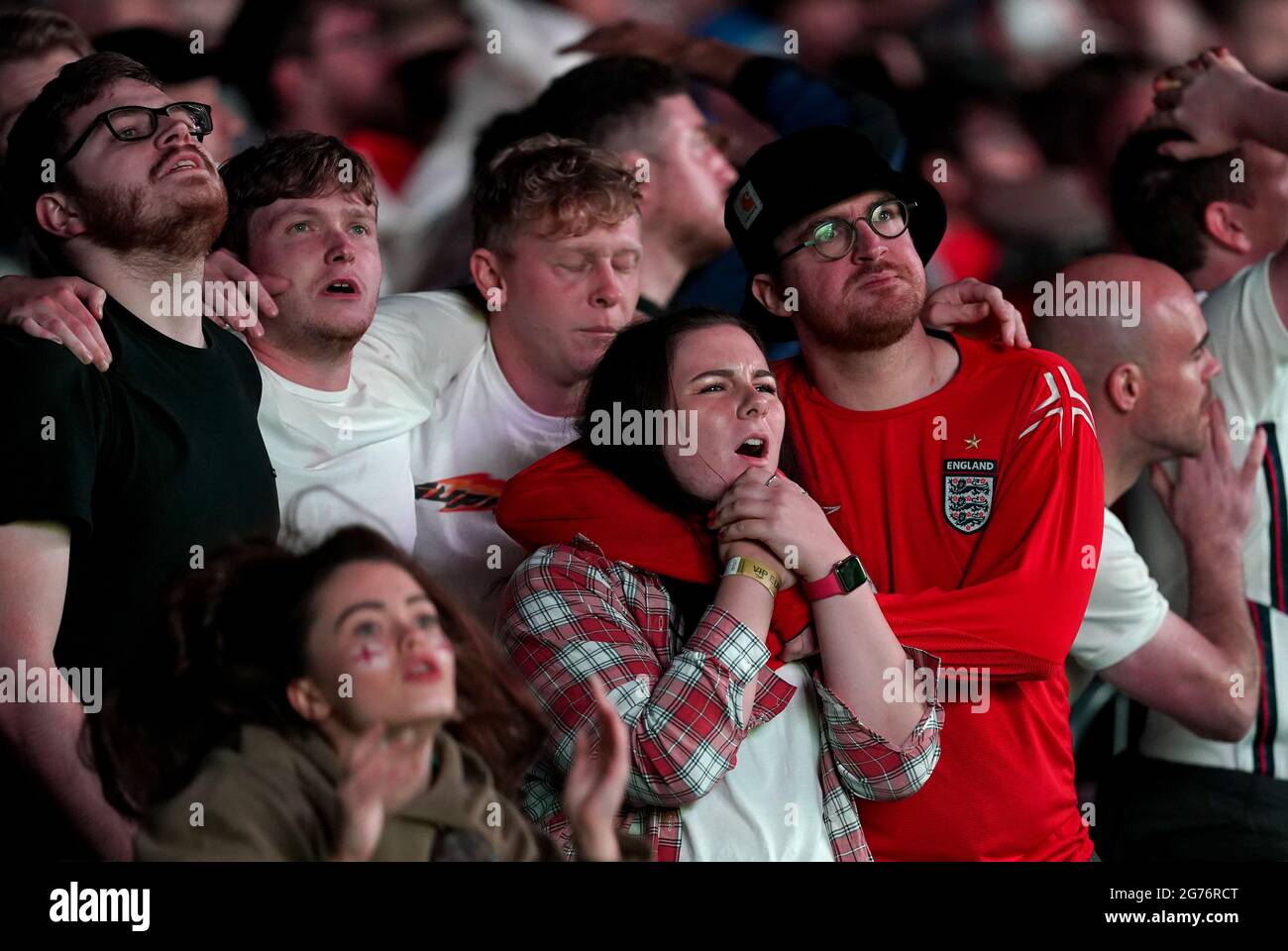 England fans are dejected after England lose the game on penalties at ...