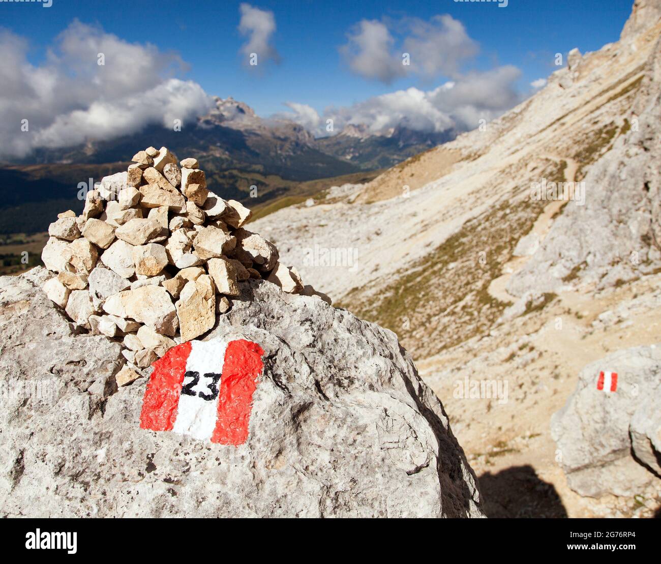 Tourist sign and stone pyramid in Dolomites alps mountains, Italy Stock ...
