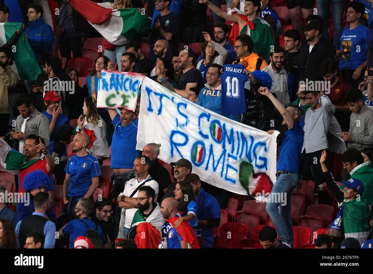 A banner reading "its coming Rome" is displayed by celebrating Italy ...