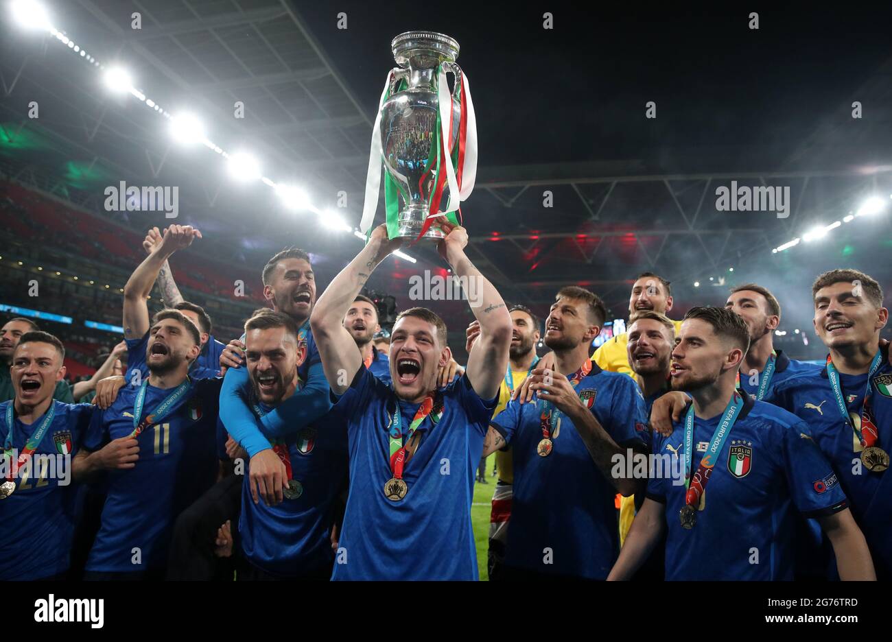 Italy's Andrea Belotti celebrates with the trophy after winning the ...