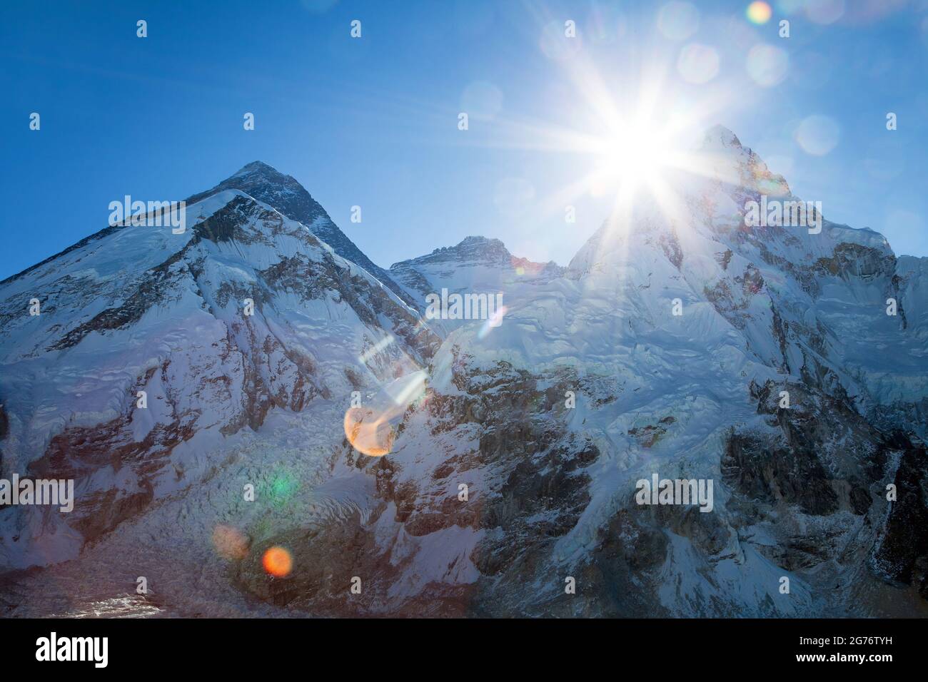 Morning sun above Mount Everest, lhotse and Nuptse from Pumo Ri base ...