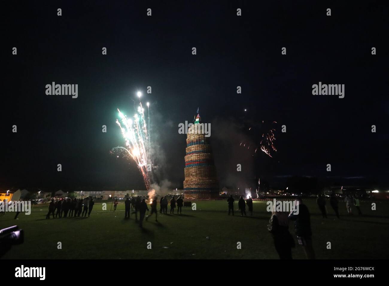 Fireowrks go off before the huge bonfire in Craigyhill, Larne, is lit ...