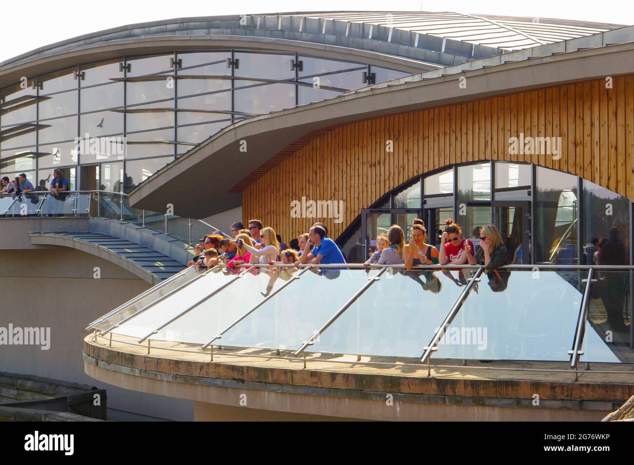 POZNAN, POLAND - Jun 20, 2015: The people standing behind a glass ...