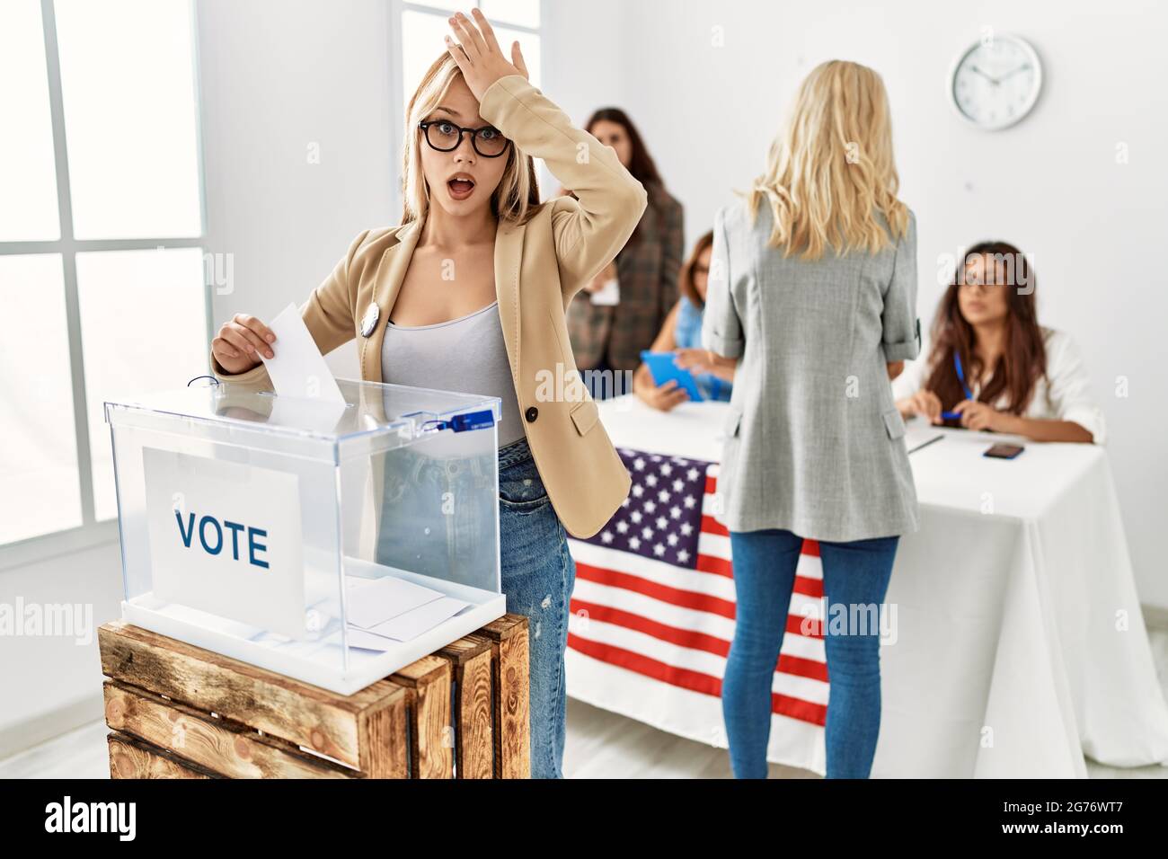 Group of young girls voting at democracy referendum surprised with hand ...