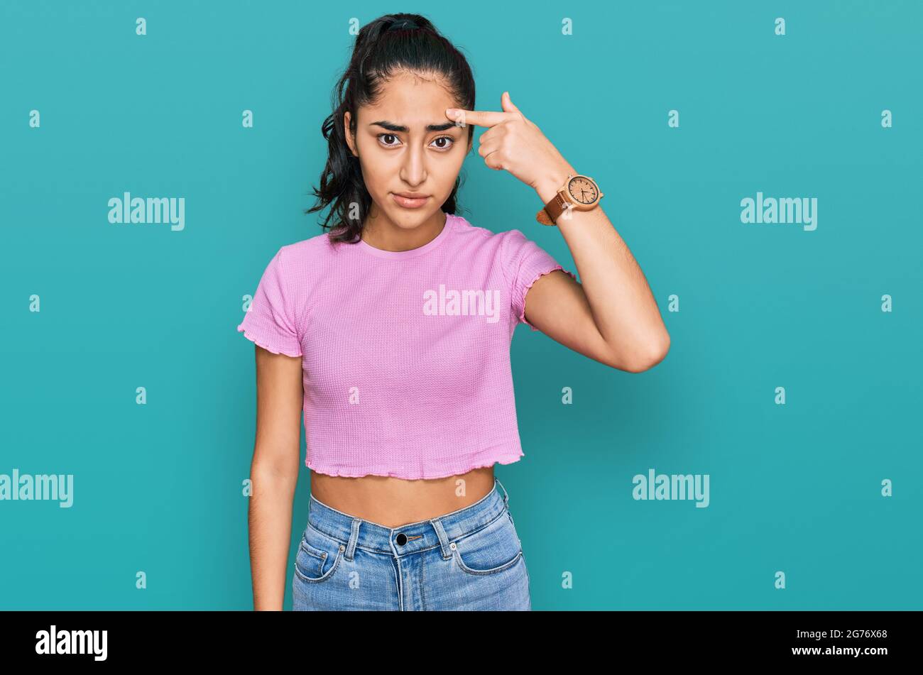 Hispanic teenager girl with dental braces wearing casual clothes ...