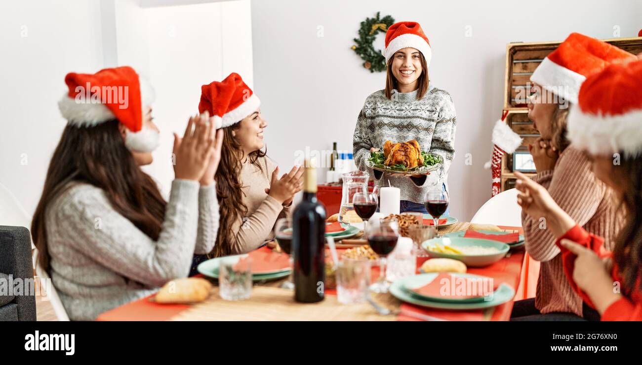 Group of hispanic women clapping and sitting on the table. Woman ...