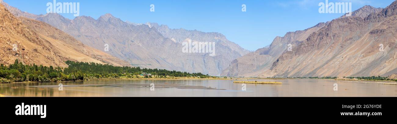 Panj river and Pamir mountains panoramic view. Panj is upper part of ...