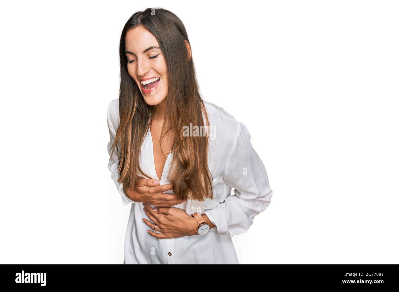 Young beautiful woman wearing casual clothes smiling and laughing hard ...
