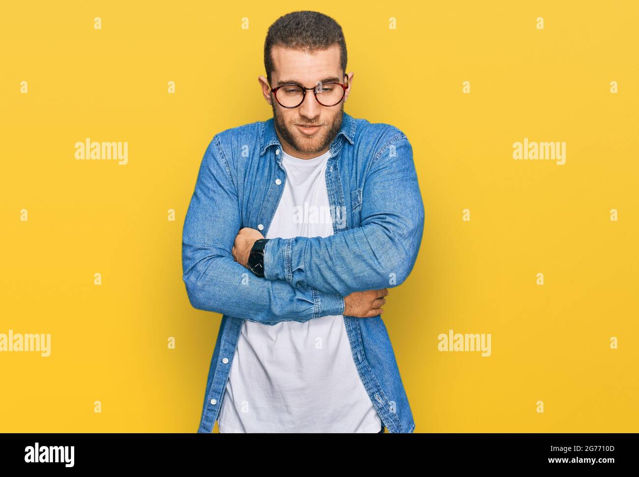 Young caucasian man wearing casual clothes shaking and freezing for ...