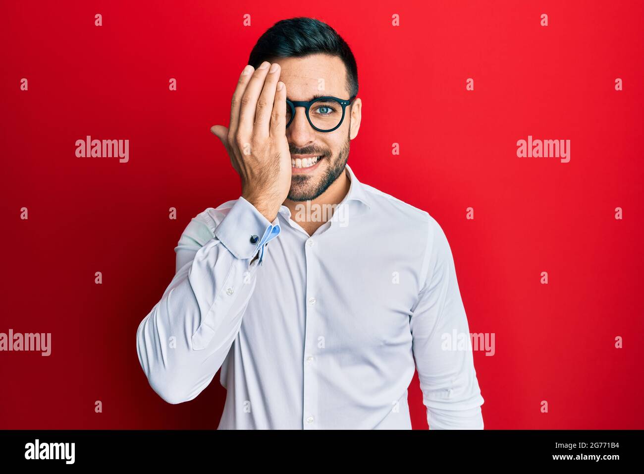 Young hispanic businessman wearing shirt and glasses covering one eye ...