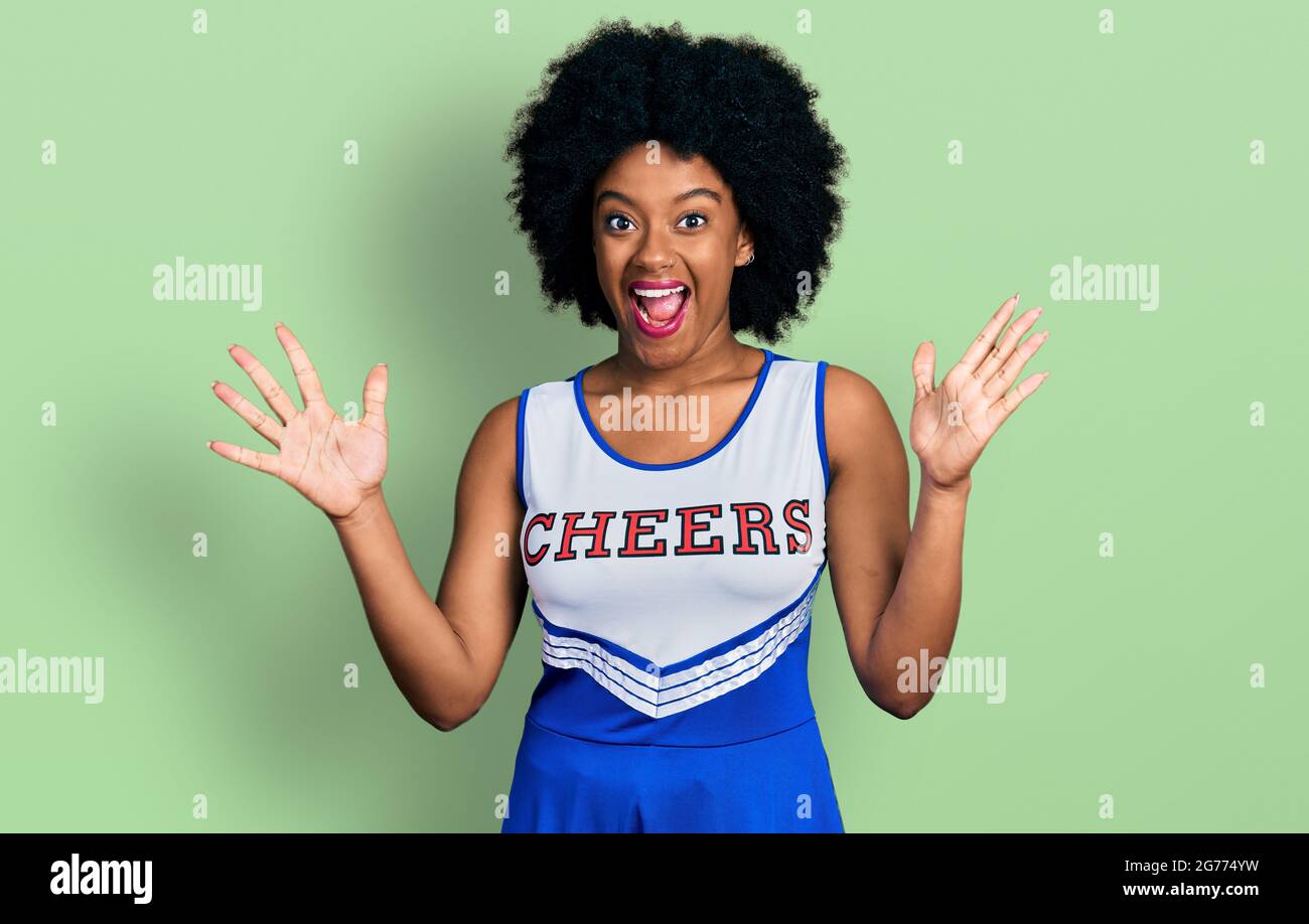 Smiling cheerleader wearing cheer team hi-res stock photography and ...
