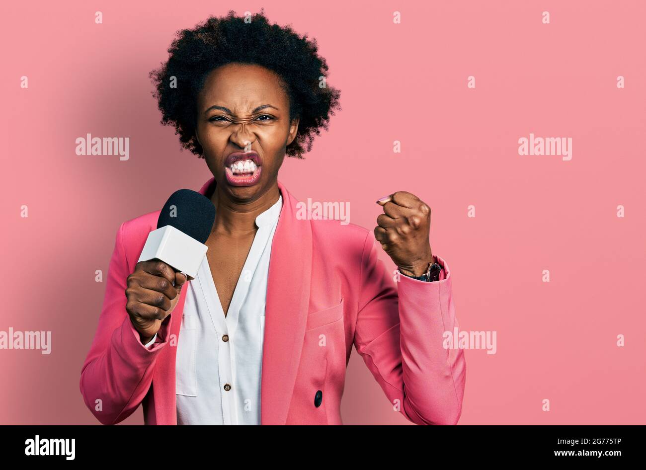 African american woman with afro hair holding reporter microphone ...