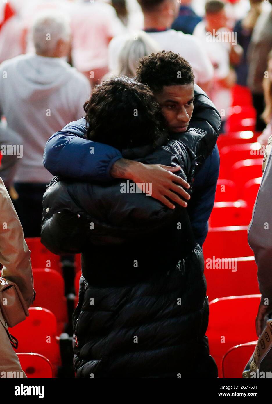 London, England, 11th July 2021. Marcus Rashford of England hugs his ...