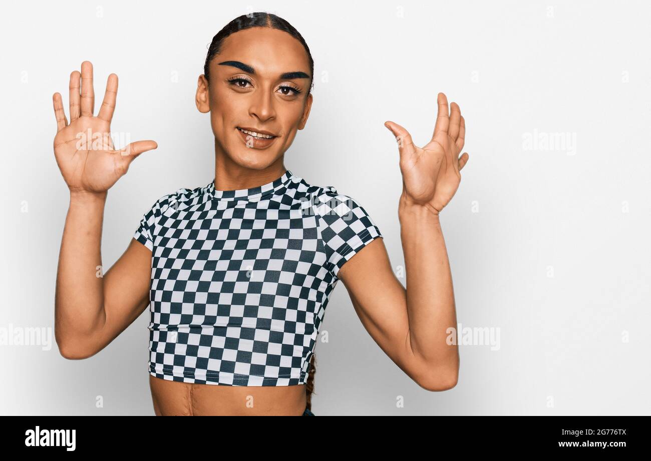 Hispanic transgender man wearing make up and long hair wearing modern ...