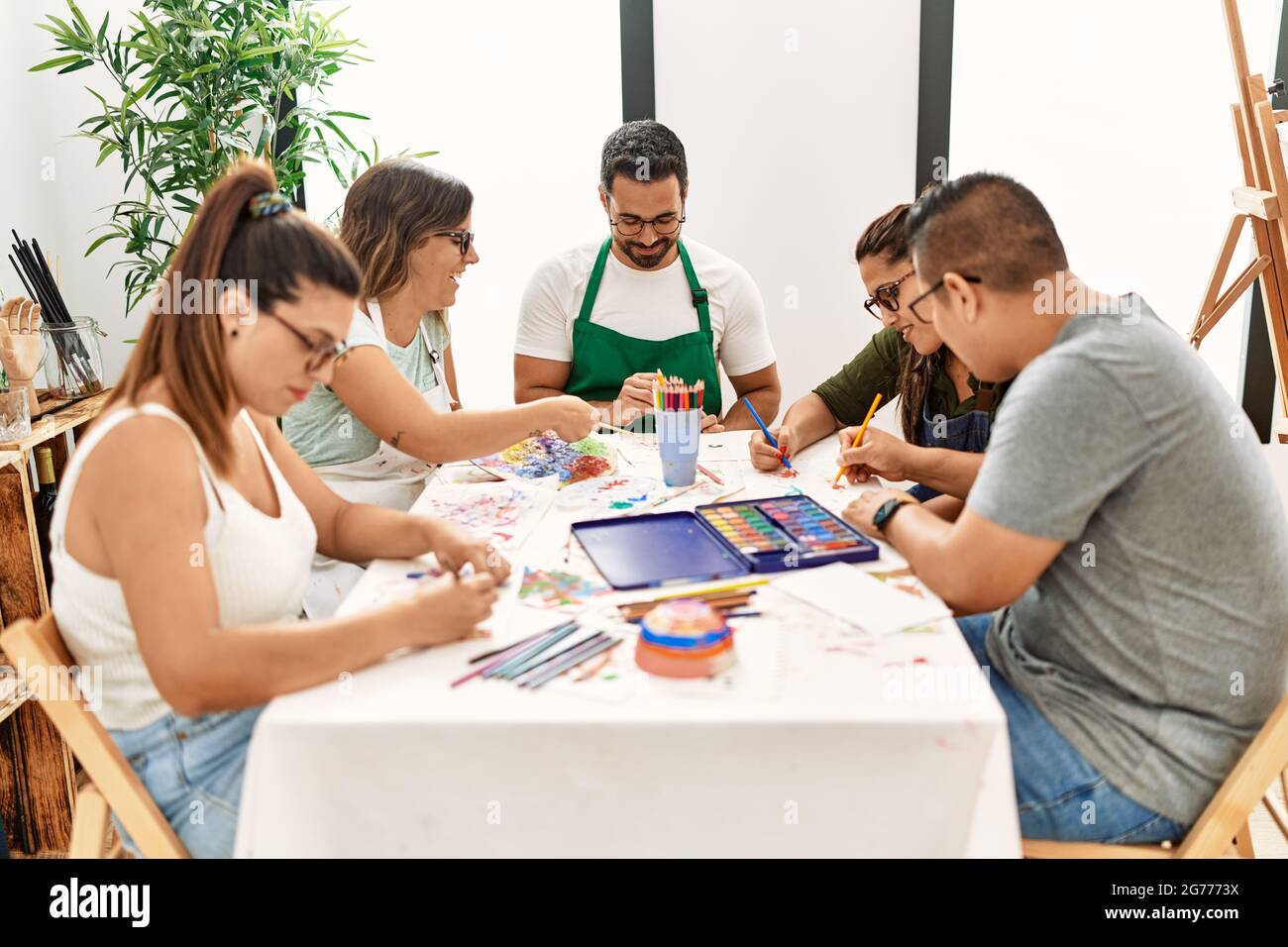 Group of draw students sitting on the table drawing at art studio Stock ...