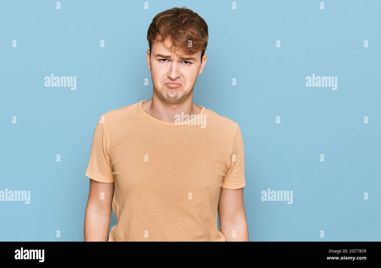 Young caucasian man wearing casual clothes depressed and worry for ...