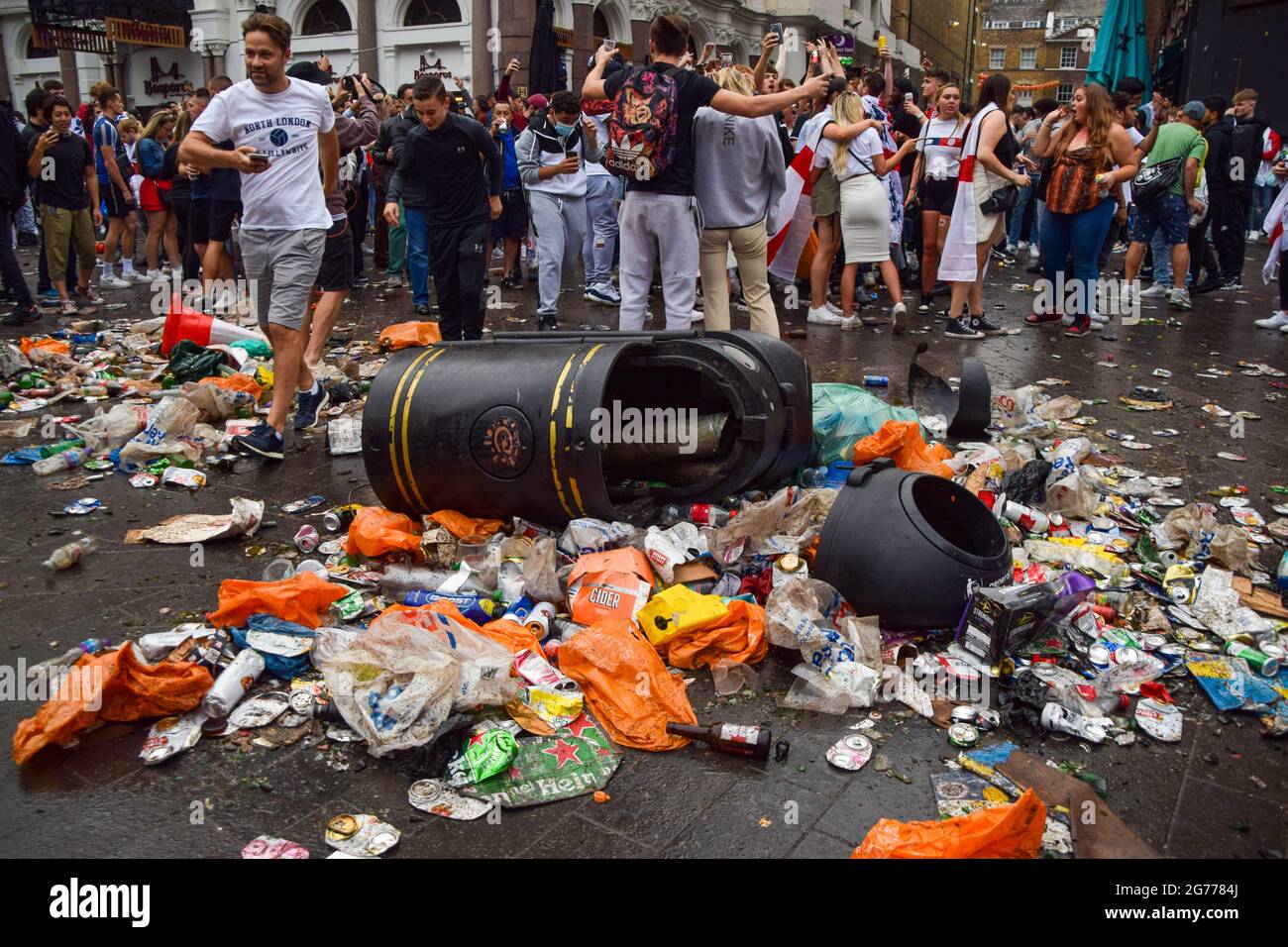 London, UK. 11th July, 2021. England supporters destroy garbage bins ...