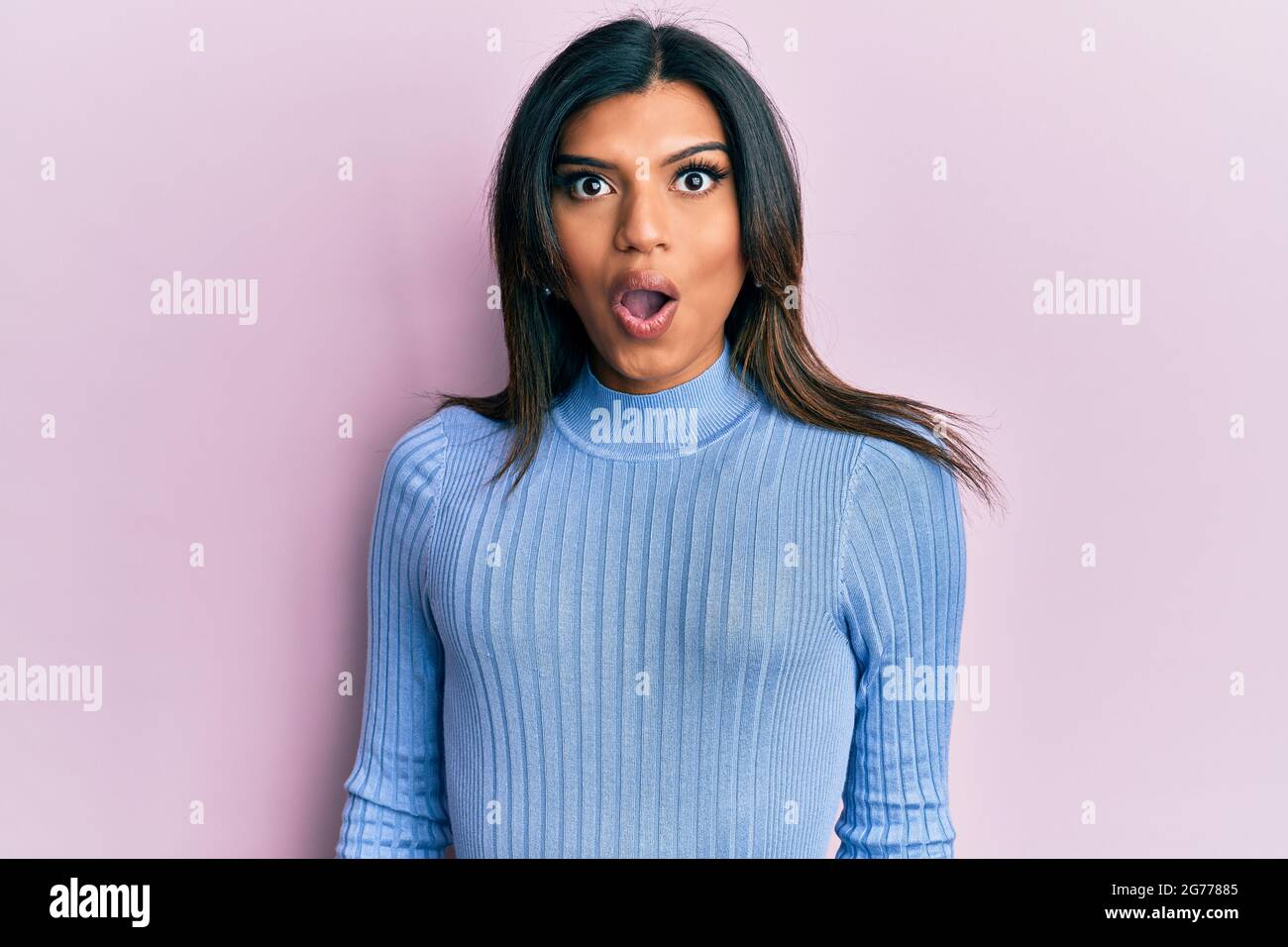 Young latin transsexual transgender woman wearing casual clothes afraid ...