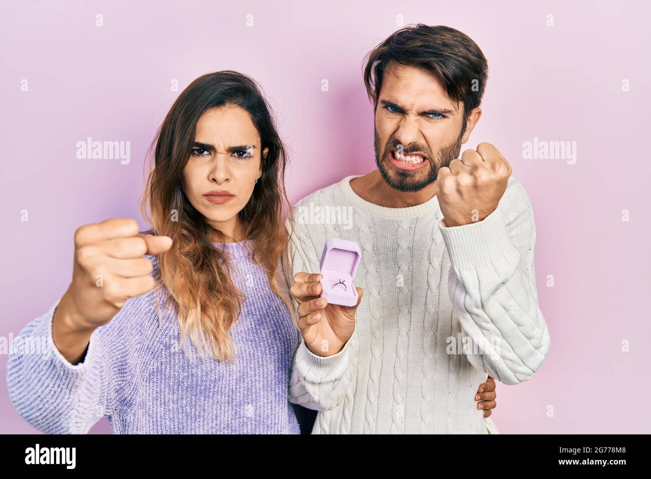 Beautiful couple of boyfriend and girlfriend holding engagement ring ...