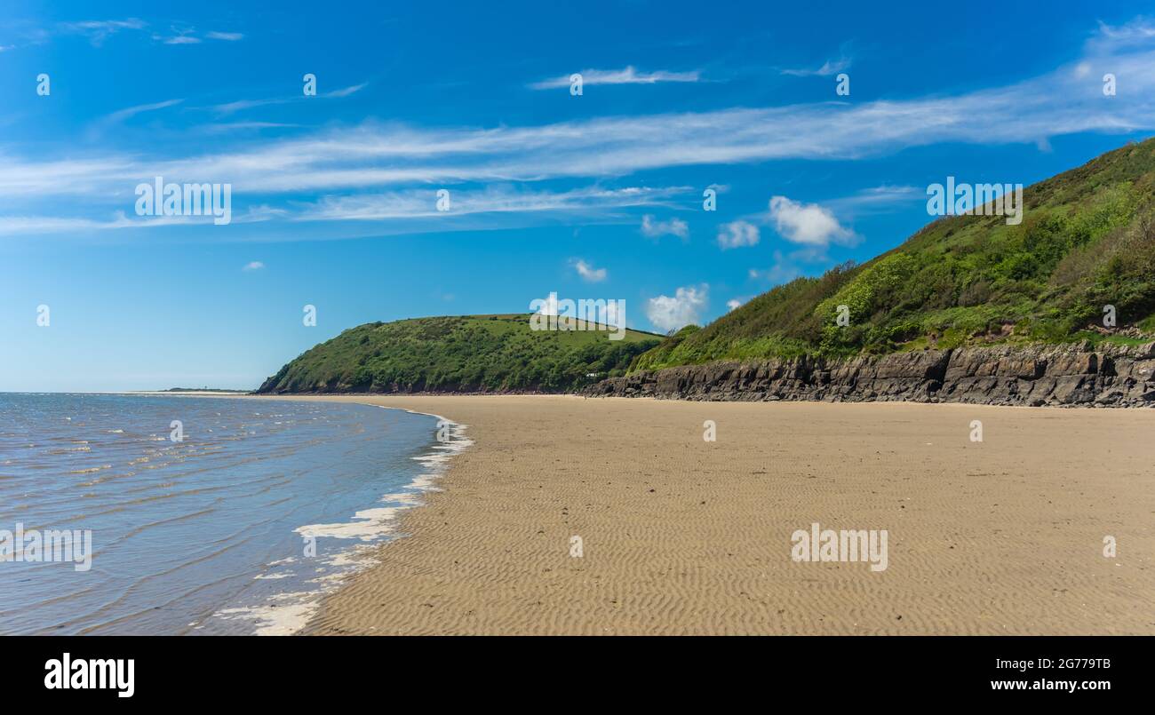 View of LLansteffan beach in southern Wales surrounded by sand and ...