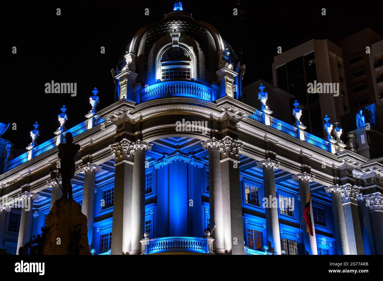 Night scene of the Townhall of Guayaquil city in Ecuador. A blue ...