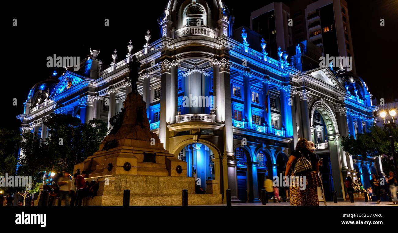 Night scene of the Townhall of Guayaquil city in Ecuador. A blue ...