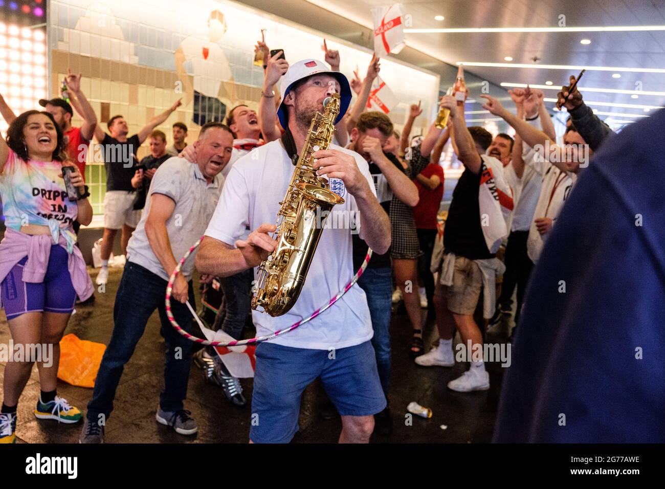 London, UK. 11th July, 2021. England football fans gather around ...