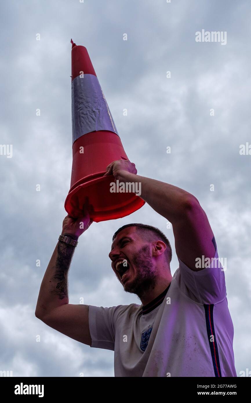 London, UK. 11th July, 2021. England football fans gather around ...